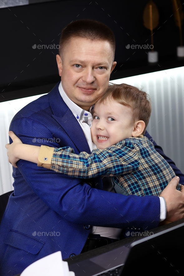 dad and son smile and hug Stock Photo by katyatsiganok | PhotoDune