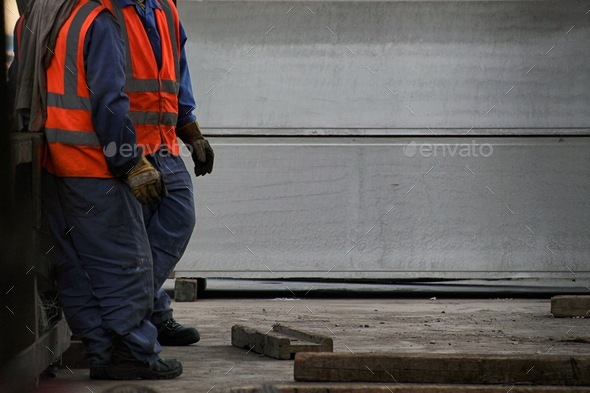 workers working on a Construction site, working hard, building ...