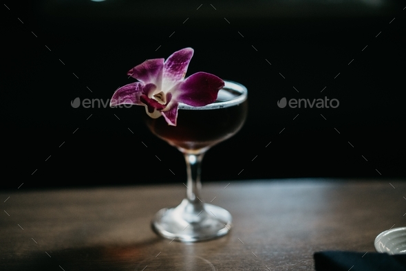Elegant classy cocktail alcoholic drink on table restaurant spotlight ...