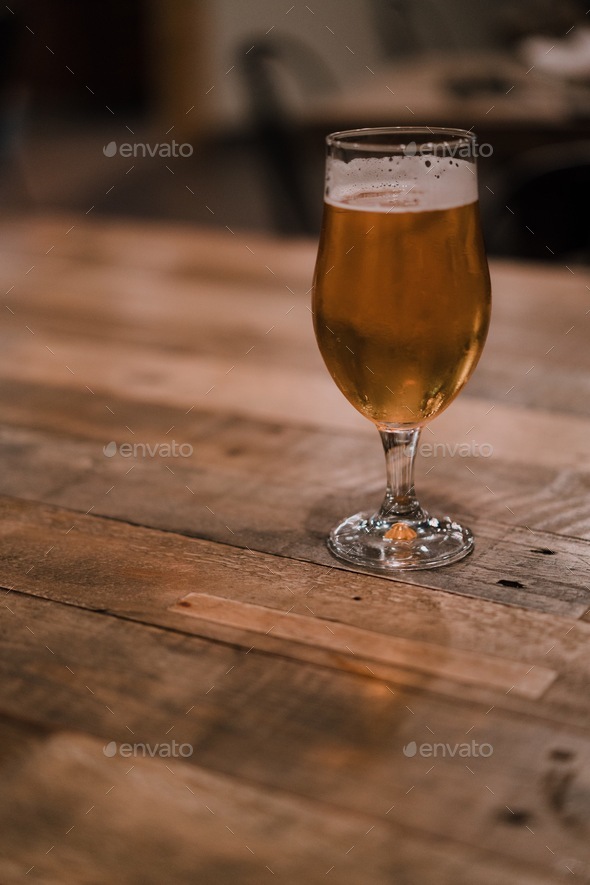 Rustic beer glass brewery bar restaurant table drinking alcohol golden ...
