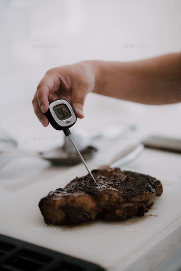 Steak cooking thermometer temperature at home in kitchen prepping ...