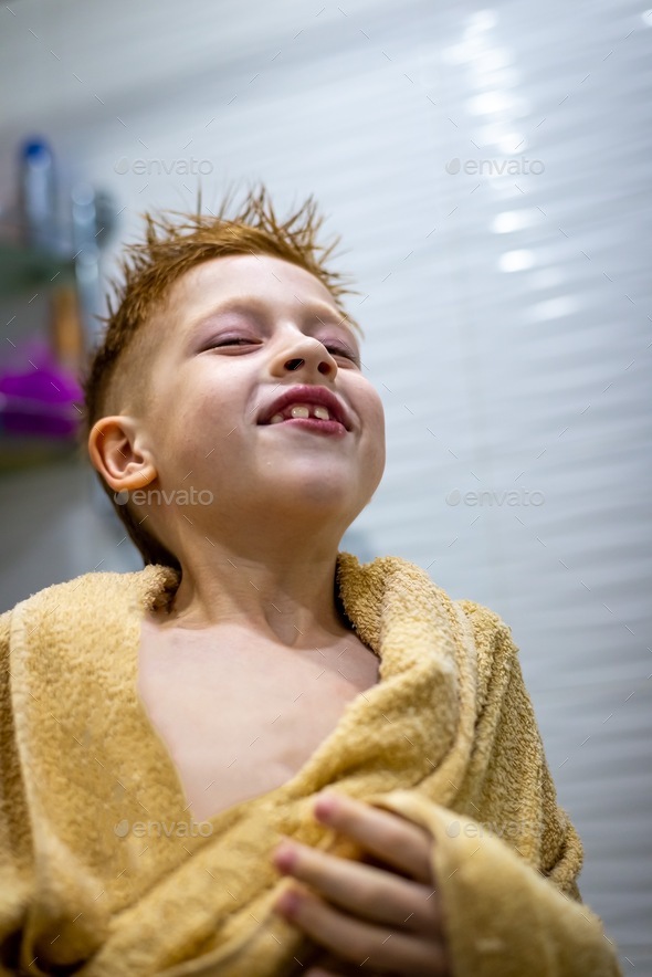 Personal hygiene, a red-haired boy got out of the bath or shower ...