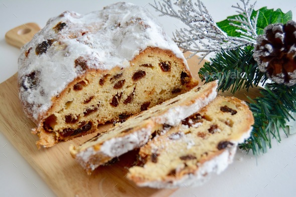Sliced Christmas stollen for winter tradition Stock Photo by Threetails05