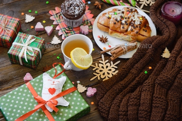 Christmas morning table with croissant (bakery), sweets and gifts. Top ...