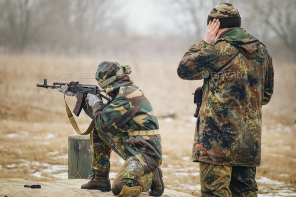 Women shooting training . Real military person with gun, soldier ...