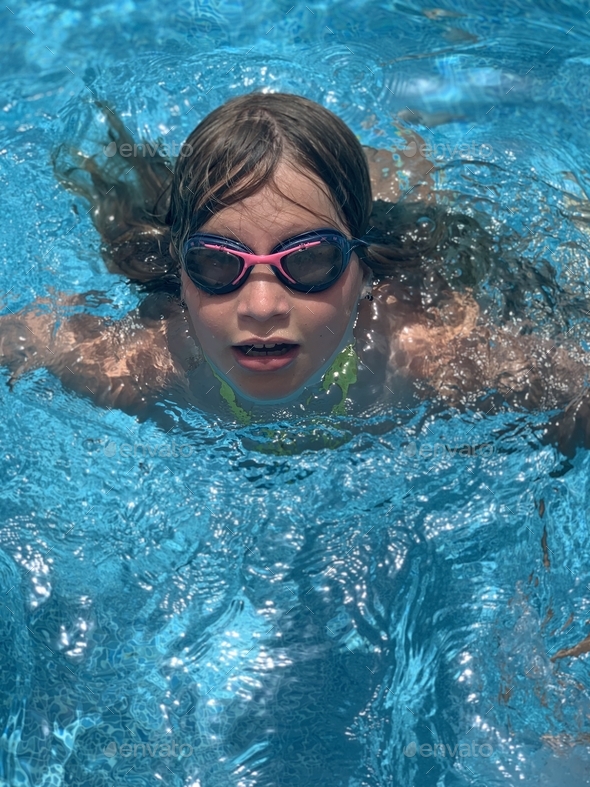 Girl swimming in the pool, face close-up Stock Photo by Artichoke-studio