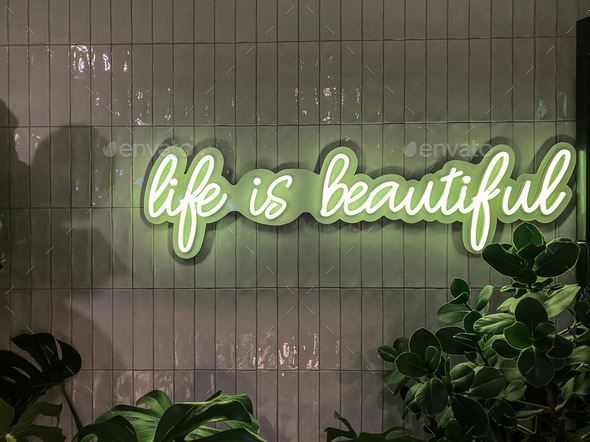 “Life is beautiful” green neon sign surrounded by plants Stock Photo by ...