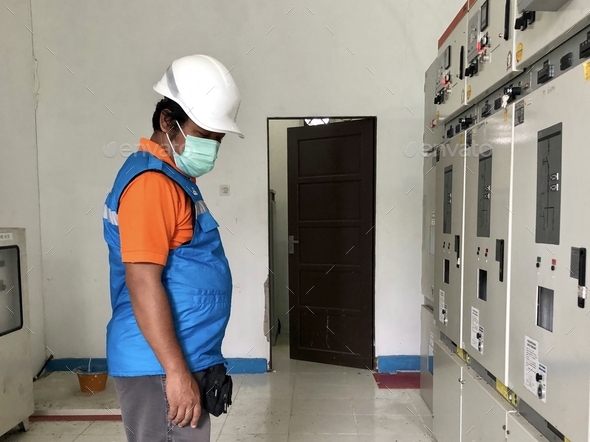 the supervisory engineer checks the cubicle 20 kv electricity substation Stock Photo by arief ...