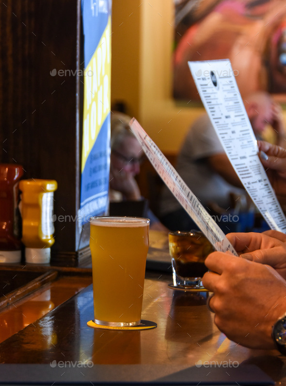 Hands holding menu at bar Stock Photo by bwise346 | PhotoDune