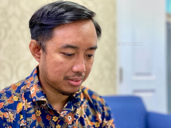 Young man wearing indonesian batik at the office Stock Photo by arief ...