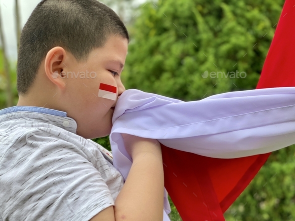 The boy kissing indonesia flag, showing love the country Stock Photo by ...