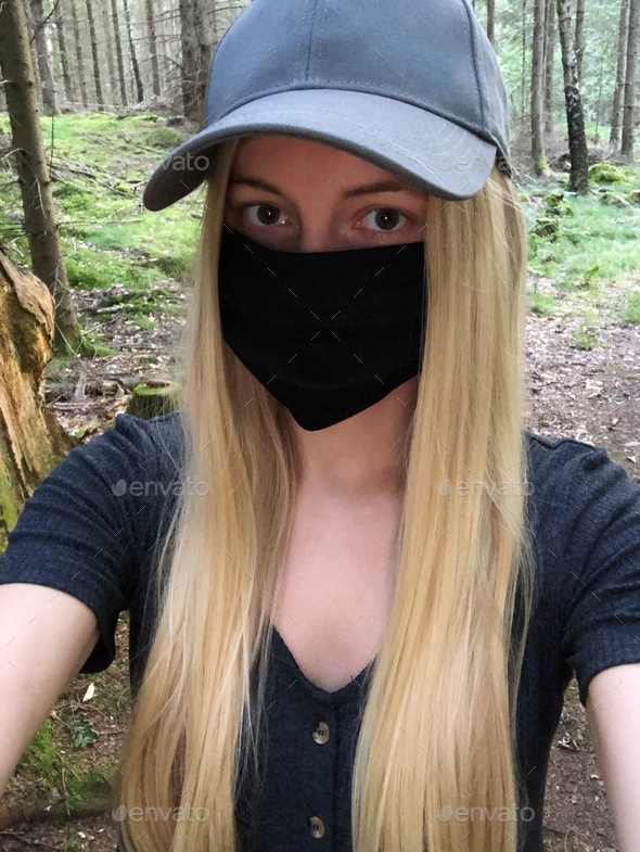 Selfie of a young woman wearing a face mask during coronavirus Stock ...