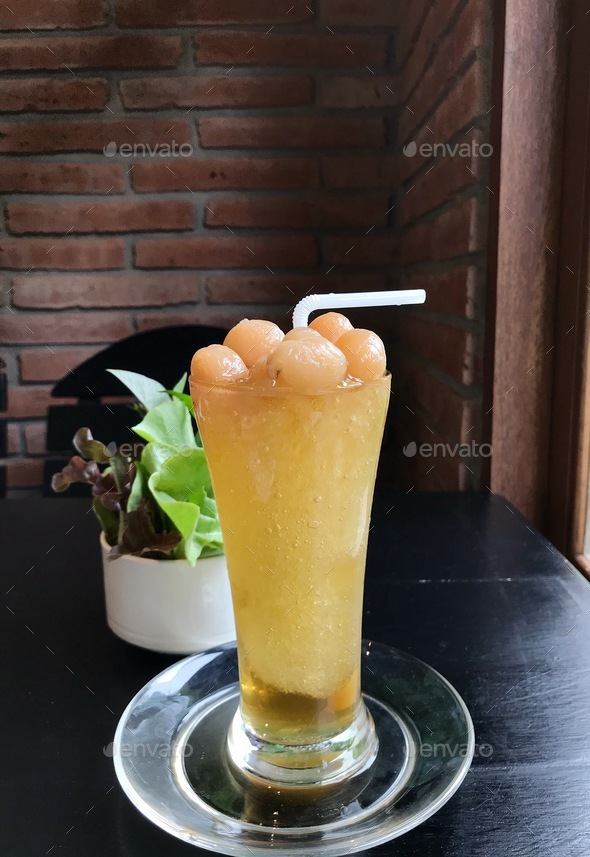 A glass of iced longan juice, a popular Thai drink in summer time ...