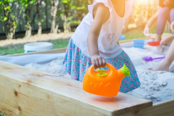 Kids playing in sandbox at home Stock Photo by nattanartp | PhotoDune