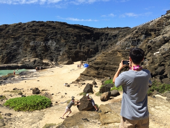 Cockroach Cove beach. Hawaii. Young traveler capturing the inspiring ...
