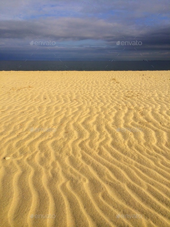Sand texture with patterns at the beach. Background with copy space ...