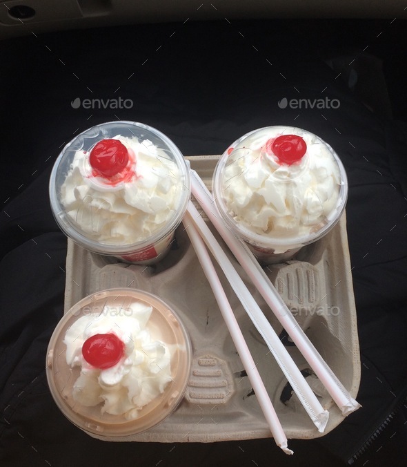 Overhead of milkshake treat on a tray with a dark background Stock ...