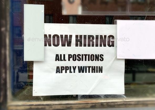 “Now Hiring All positions Apply Within” sign displayed at business’s ...