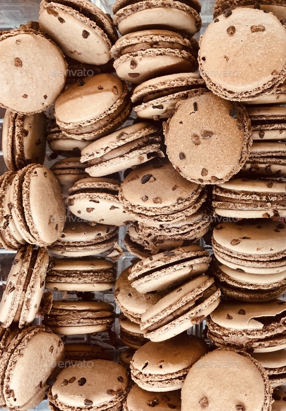 Overhead of brown chocolate delicious macarons / macaroons background ...