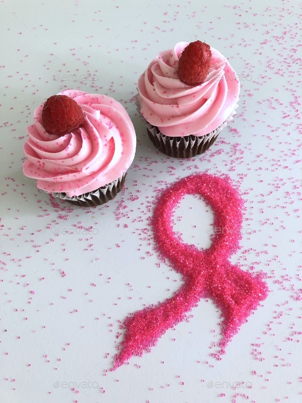 October is breast cancer awareness Month. Pink cupcakes with pink ...