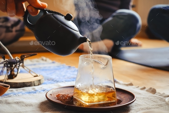Master making chinese tea in traditional ceremony and pouring tea from ...
