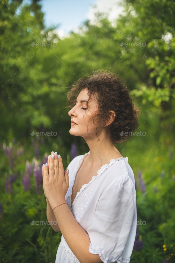 The girl is praying. Prayer to God. Believer. Hope and Prayer. Faith ...