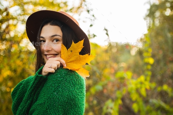 Beautiful smiling girl rejoice in autumn. Autumn portrait of a girl ...
