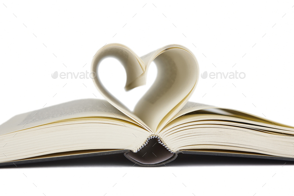 Open book with heart shaped pages. Love for reading Stock Photo by ABBPhoto