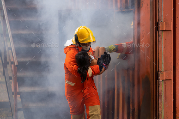 Fire fighting team rescue life saving young girl from fire burn and ...