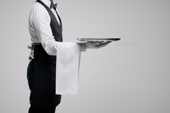 Elegant waiter in uniform carrying tray Stock Photo by kegfire | PhotoDune