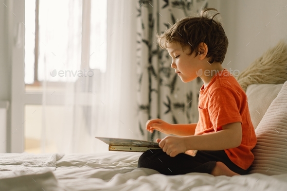 Kids read books. Little boy reading at home. Children home schooling ...
