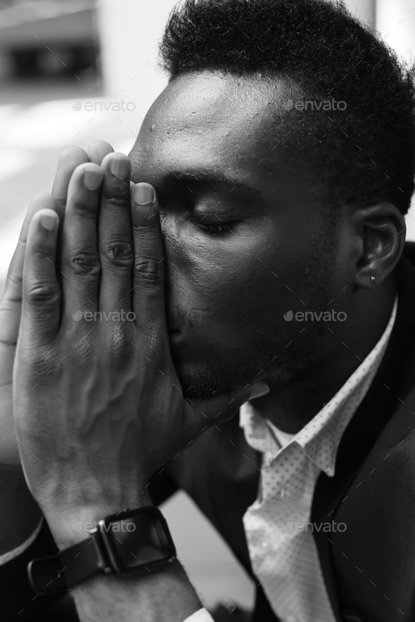 sad african guy going through emotional upheaval Stock Photo by ...