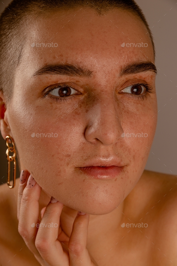 A swarthy girl with short hair and freckles. Authentic close-up ...