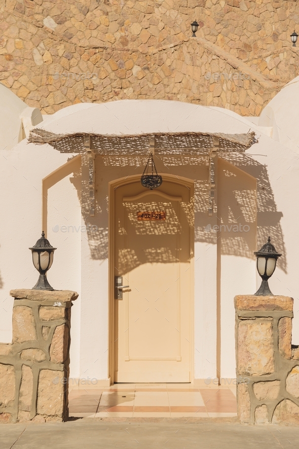 Shadows on the beautiful sand-colored building of the hotel ...