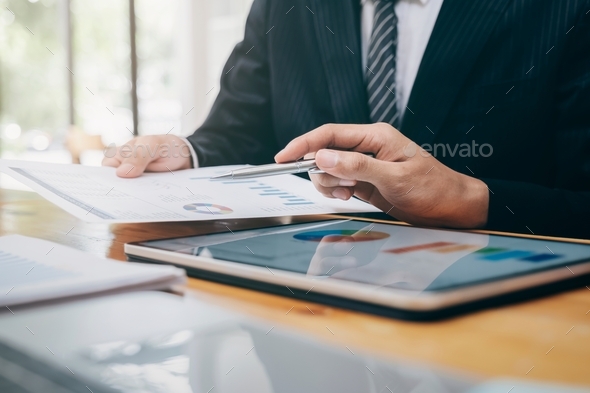 Creative businessman and co-workers working together in office focus at ...