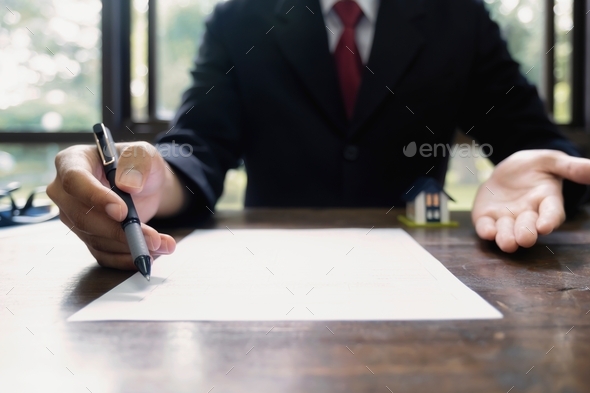 Businessman Explaining Documents To Co worker Stock Photo by ijeab