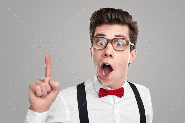 Geek pointing up in studio Stock Photo by kegfire | PhotoDune