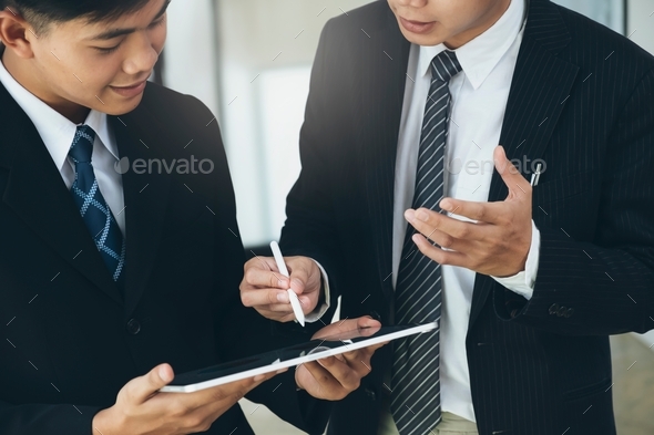 Creative businessman and co-workers working together in office focus at ...