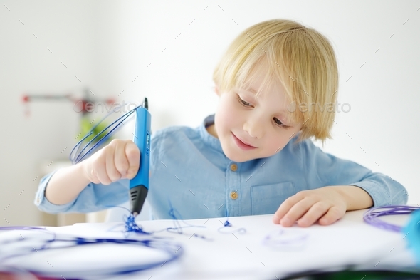 Little boy learning make model with 3d printing pen. Child playing with ...