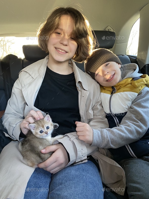 happy kids and their new furry pet Stock Photo by yuliia_lisiana ...