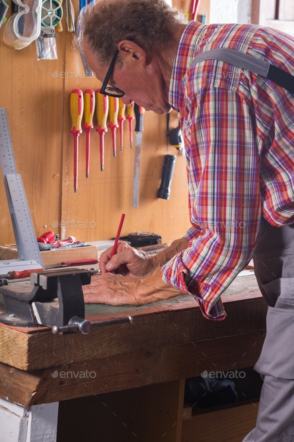 Carpenter working on the work bench, joinery tools and woodwork Stock ...
