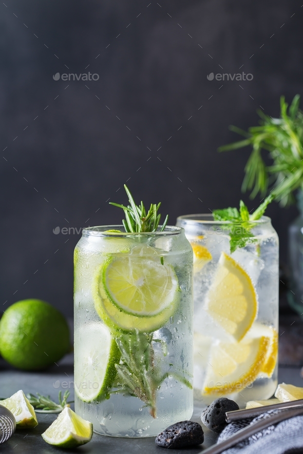 Hard seltzer cocktails with lime and lemon and bartenders accessories ...