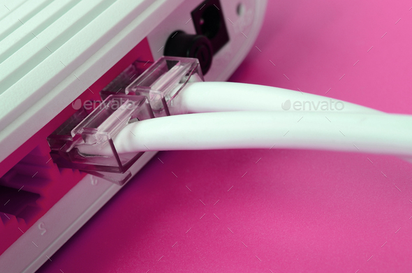 The Internet cable plugs are connected to the Internet router Stock ...