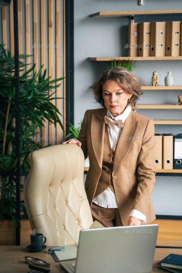 Confident stylish mature middle aged elderly woman in office. General ...