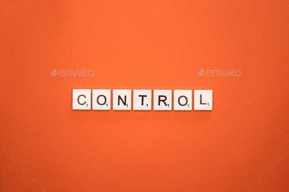 Control scrabble letters word on a orange background Stock Photo by ...