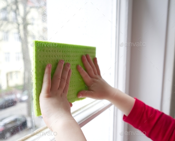 children's hands wipe the window with a sponge Stock Photo by ...