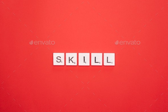 Skill scrabble letters word on a red background Stock Photo by ...
