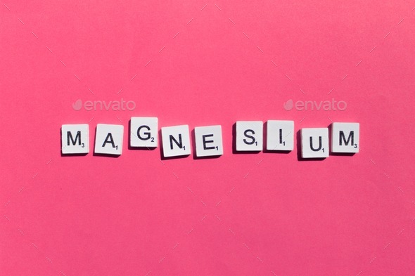 Magnesium scrabble letters word on a pink background Stock Photo by ...