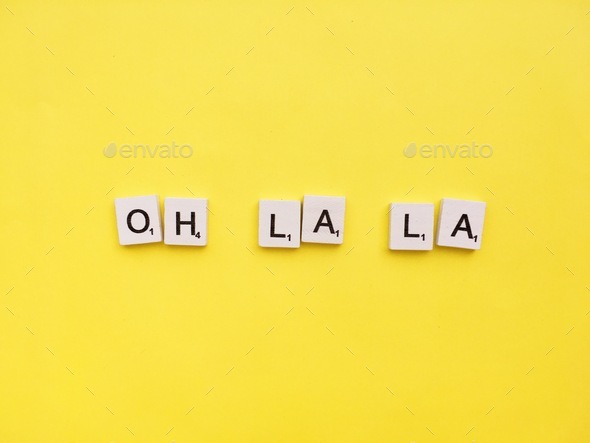 Oh la la scrabble letters word on a yellow background Stock Photo by ...