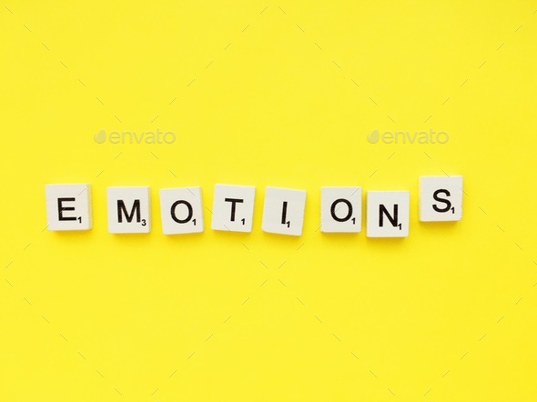 Emotions scrabble letters word on a yellow background Stock Photo by ...